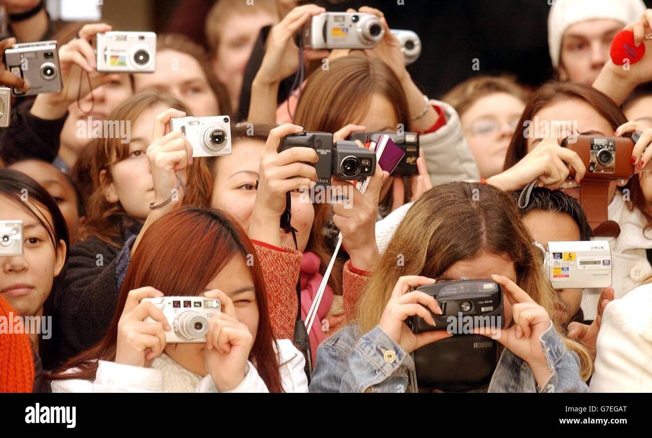 Britain's Queen Elizabeth II is the centre of attention as students use ...