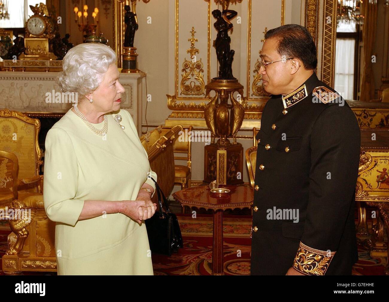 Britain's Queen Elizabeth II talks with Mr Hor Nambora, the Ambassador ...