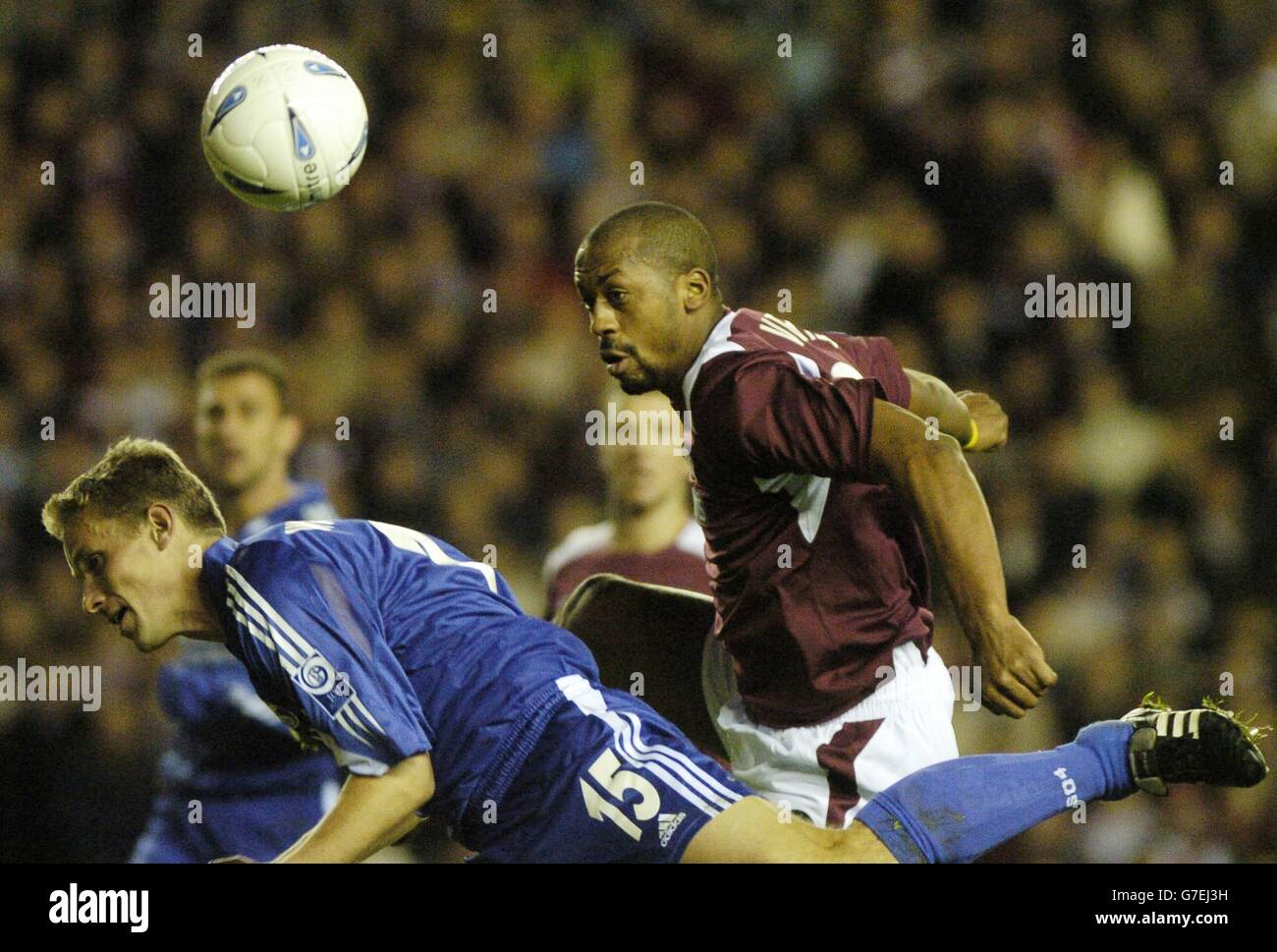 Hearts' Marc De Vries (right) challenges Schalke 04's Tomasz Waldoch ...