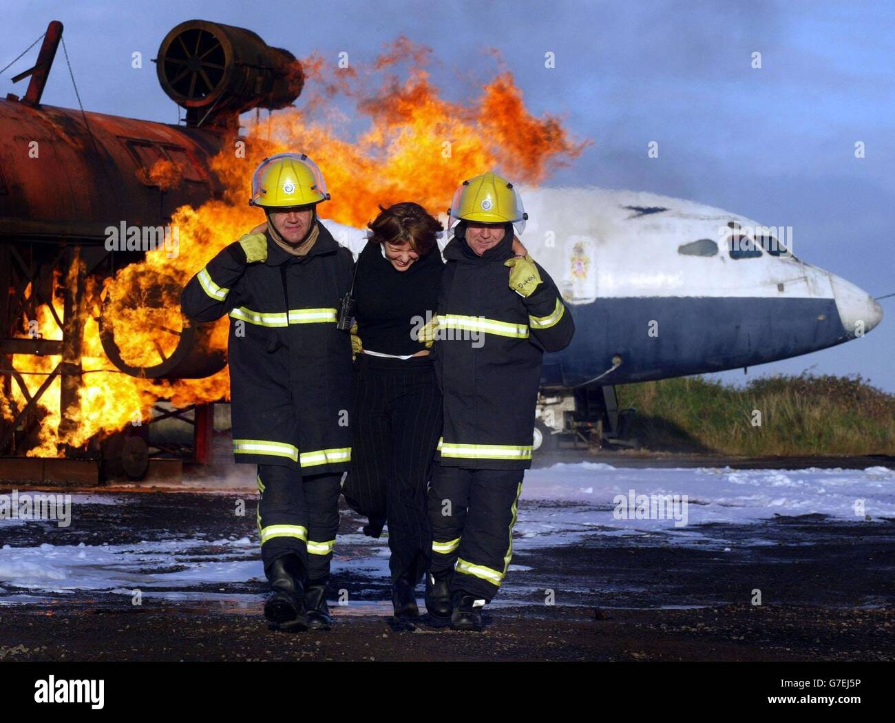 Firemen practice a rescue mission, from a burning plane at Belfast ...