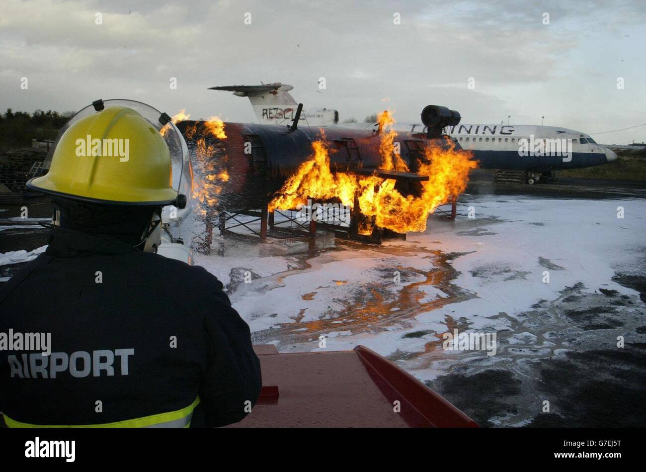 Fireman practice rescue from burning plane Stock Photo - Alamy