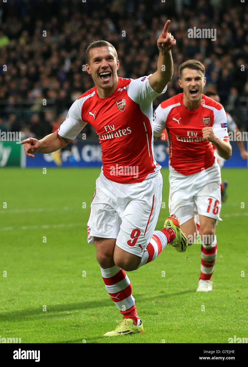 Arsenal's Lukas Podolski celebrates scoring his side's second goal of ...
