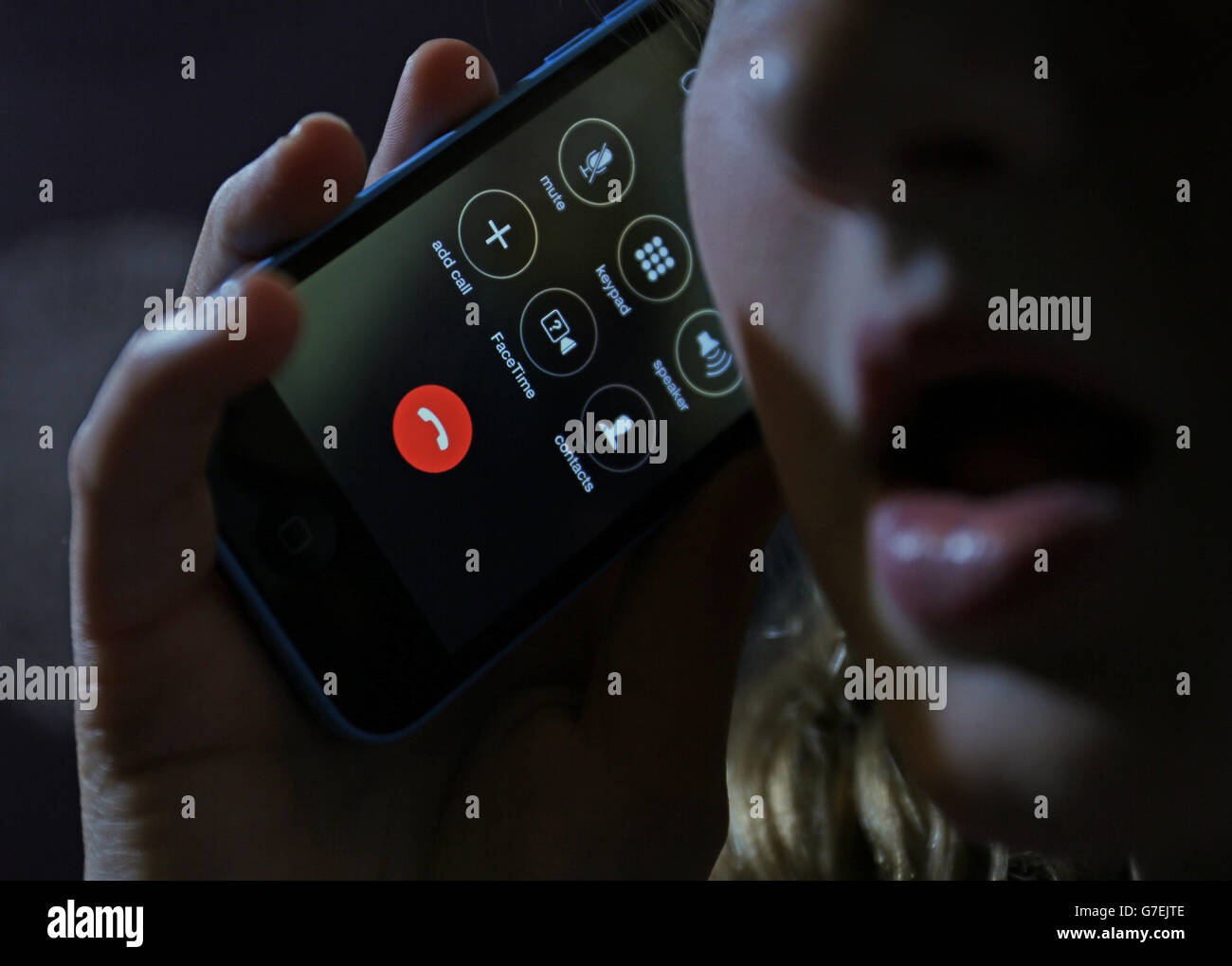 Stock picture of a teenage girl using an iphone mobile phone Stock ...