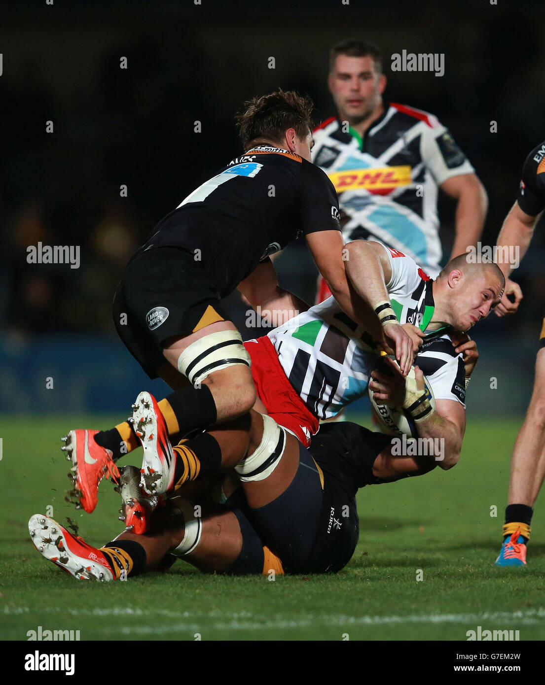 Harlequins Mike Brown is tackled by Wasps Ed Jackson and Sam Jones ...
