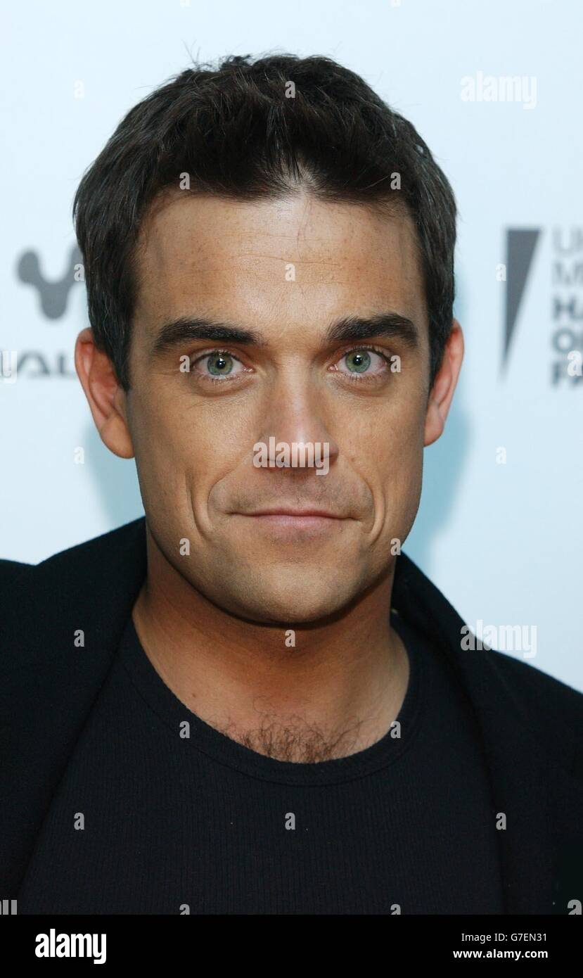 Singer Robbie Williams receives the audience vote for the 90s decade ...