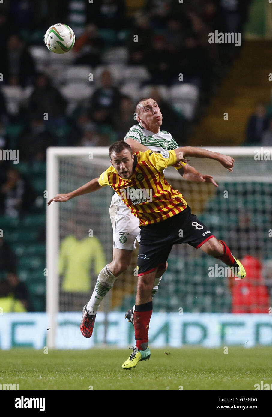 Celtic's Scott Brown (back) and Partick Thistle's Stuart Bannigan battle for the ball during the ...
