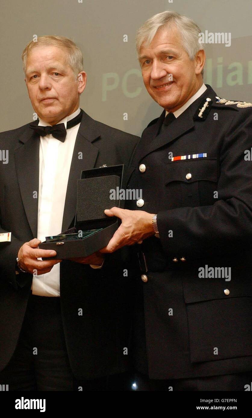 Ken Craig (left) is presented with a Lifetime Achievement in Policing ...