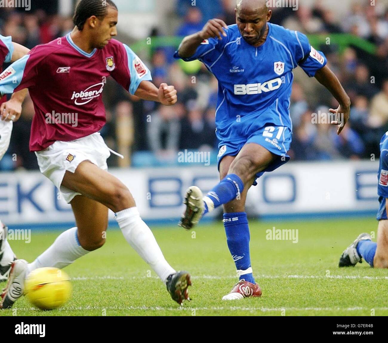 Millwall's Barry Hayles is faced by West Ham United defender Anton ...