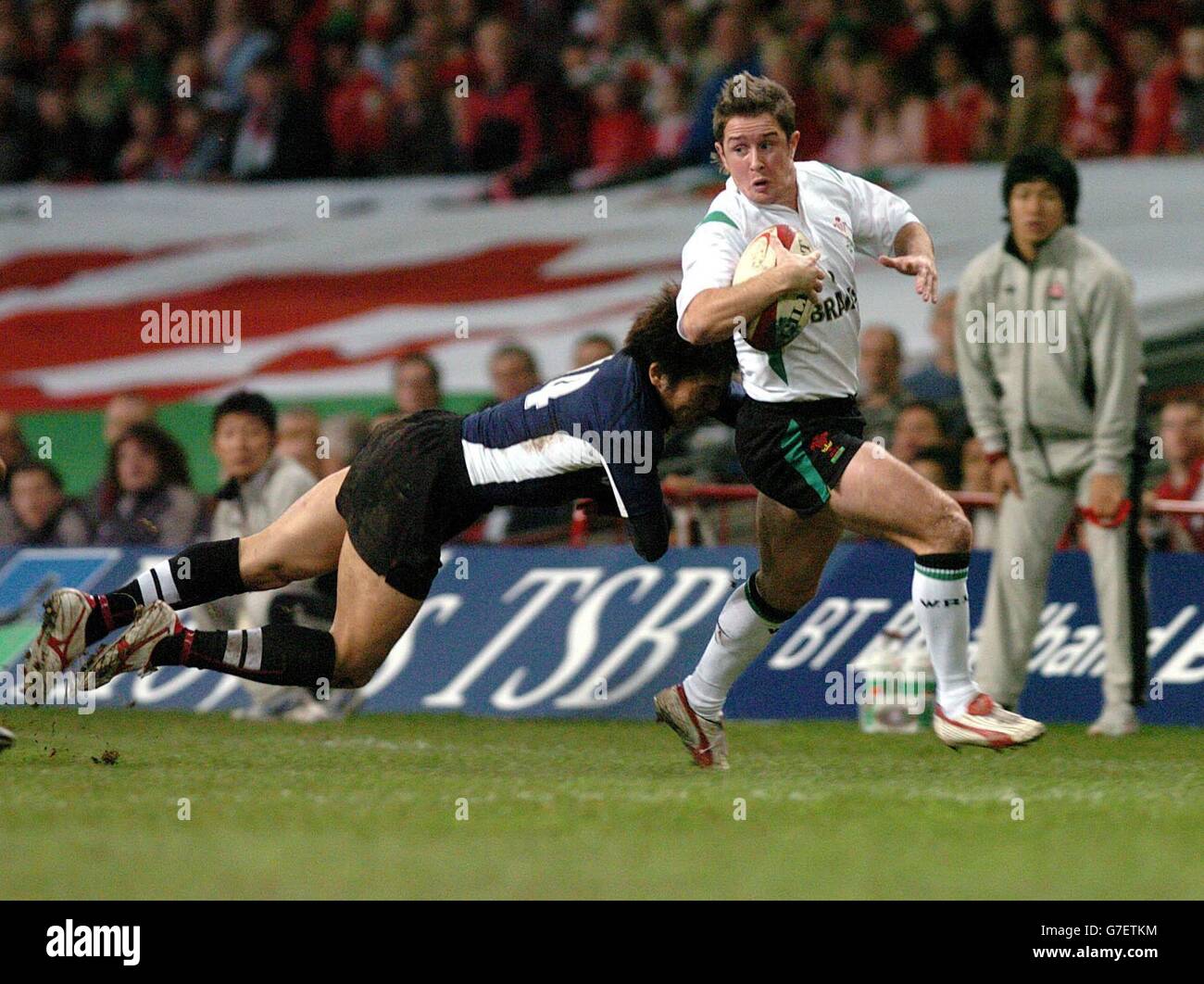 Wales' Shane Williams rounds his marker, Japan's Koichiro Kubota ...