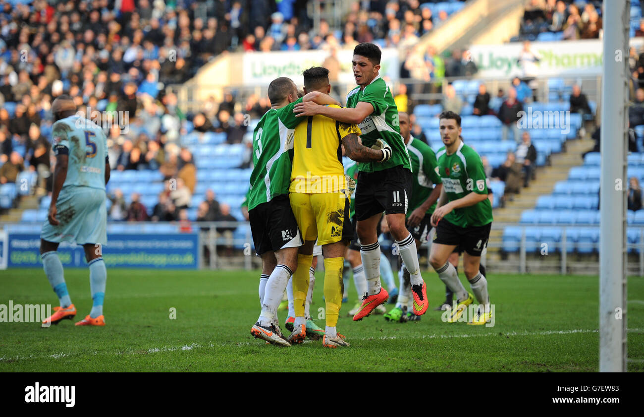 Worcester City's goalkeeper Nathan Vaughan (centre) is congratulated by ...