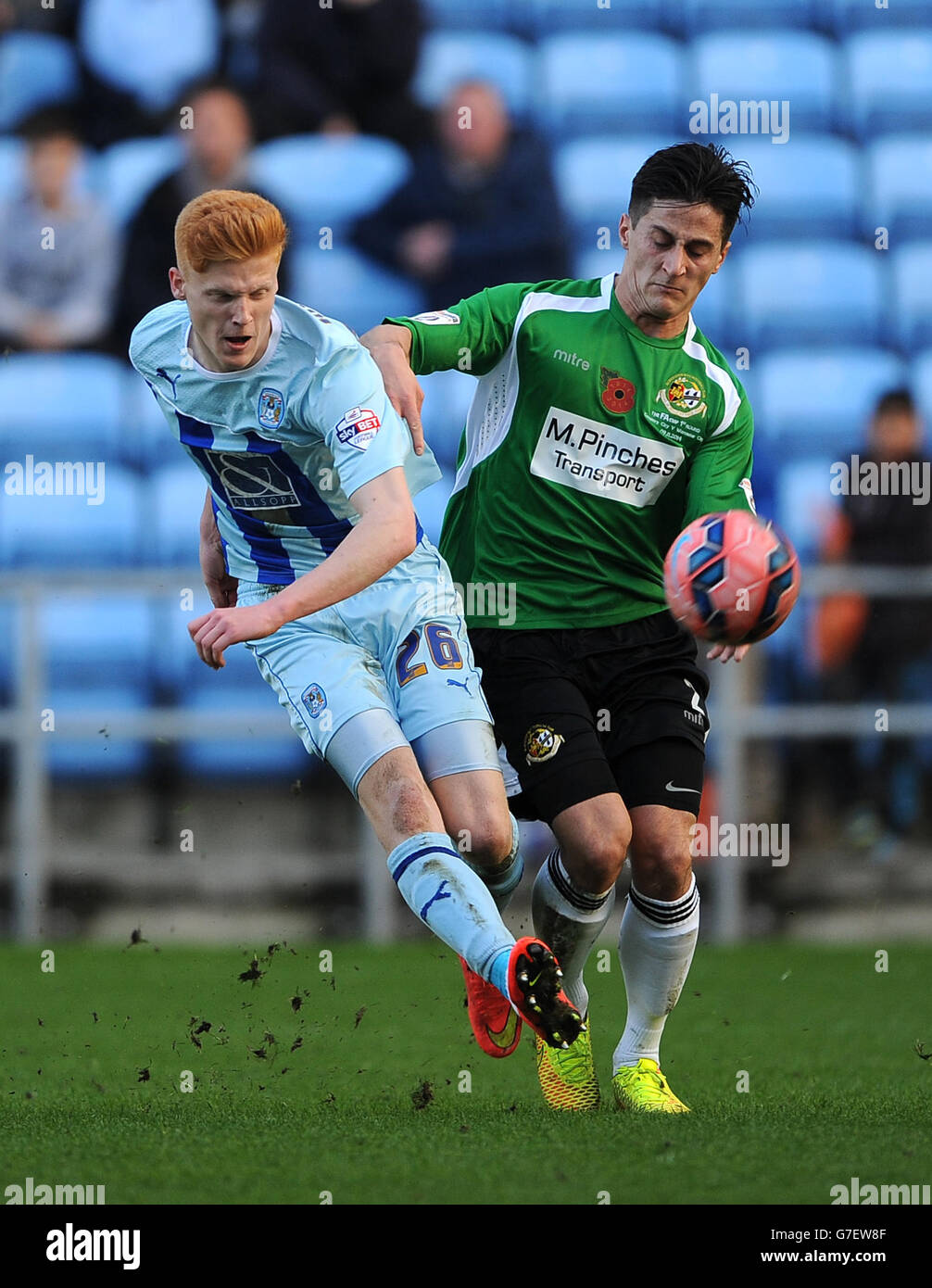 Coventry City's Ryan Haynes (left) has a shot on goal under pressure ...