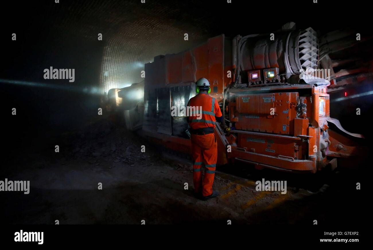 Miners work at the salt face, 500ft below the surface at the Compass ...