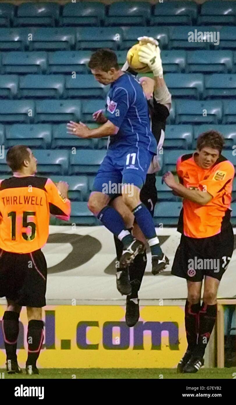 Sheffield United's goalkeeper Paddy Kenny takes the ball from Millwall ...