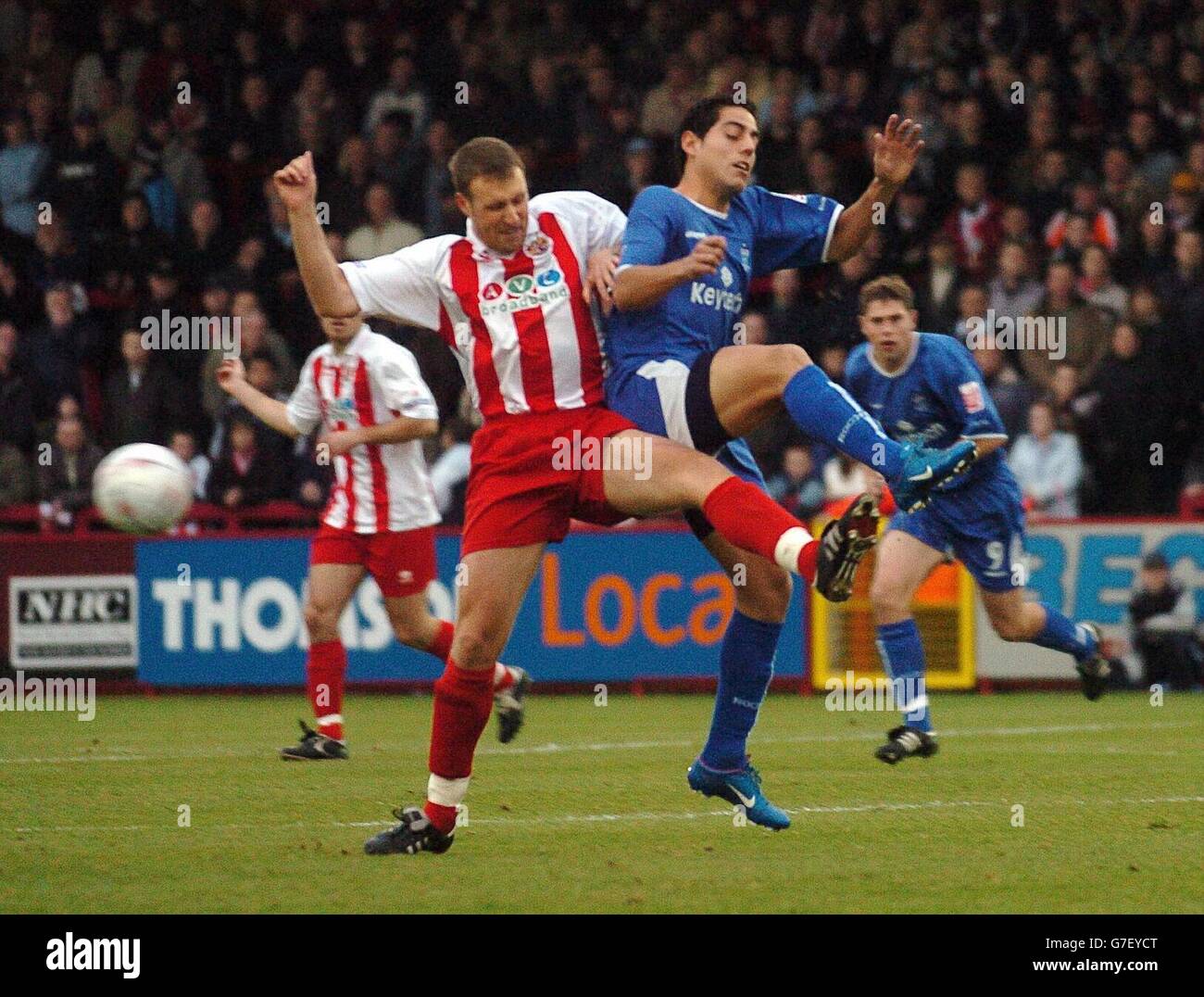 Stevenage's Mark Rodgers (left) and Rochdale's Leo Gallimore clash ...