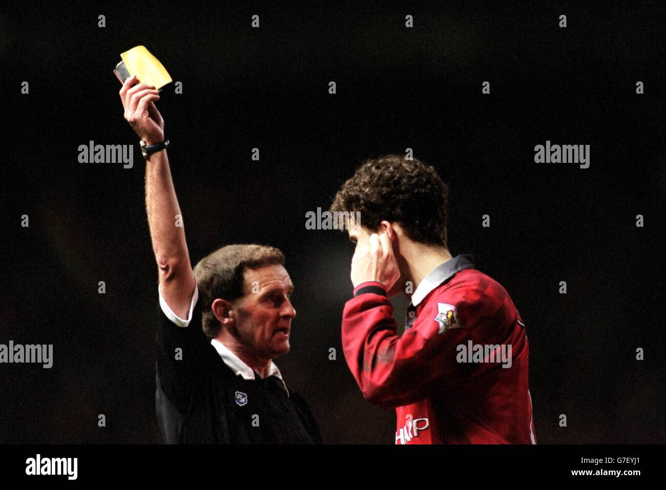 Ronny Johnsen, Manchester United receives the Yellow card from referee ...
