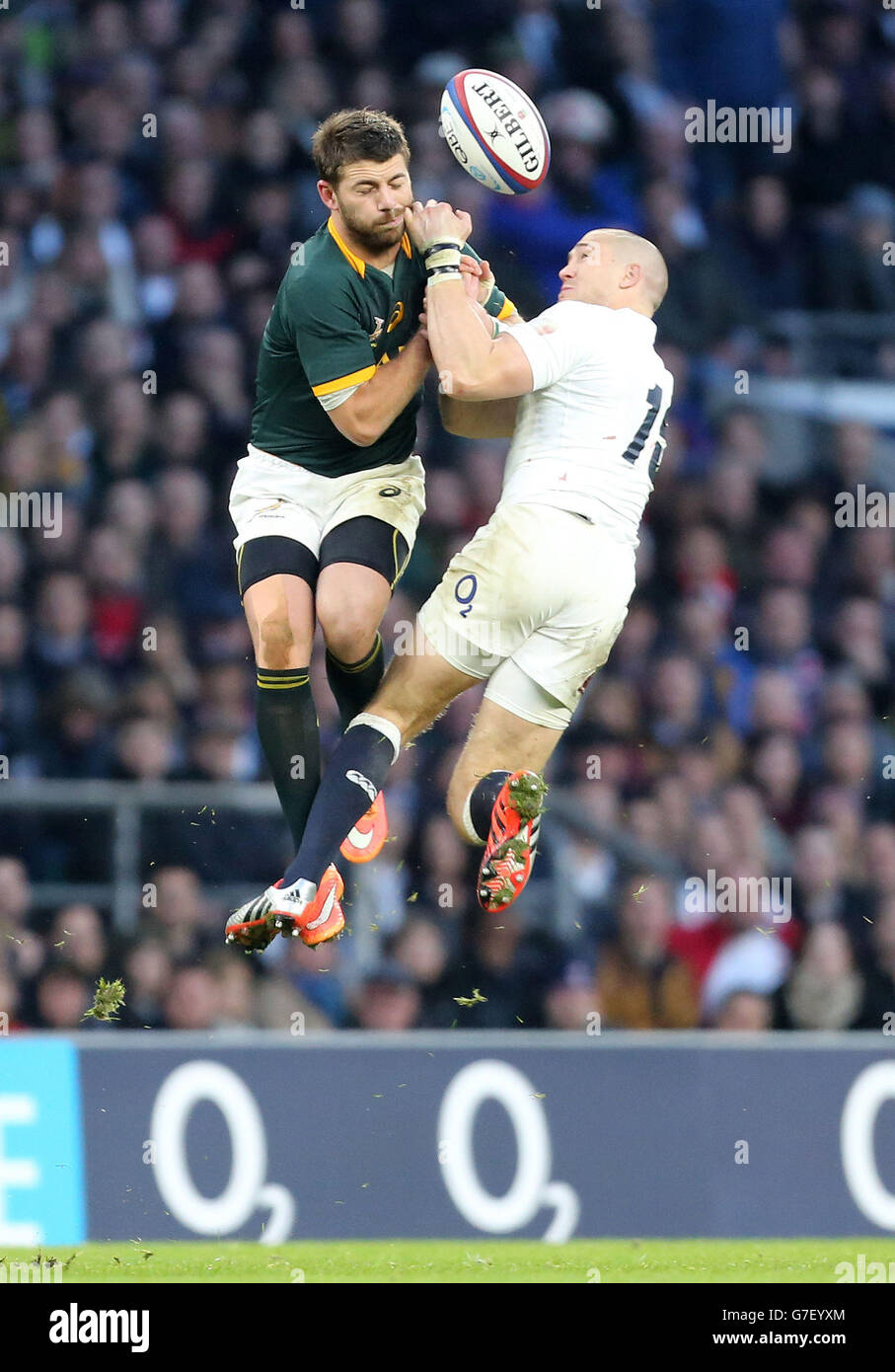 England's Mike Brown and South Africa's Willie le Roux (left) collide ...