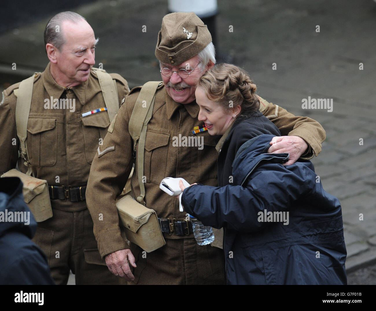Actor Sir Tom Courtenay who plays Corporal Jones hugs another cast ...