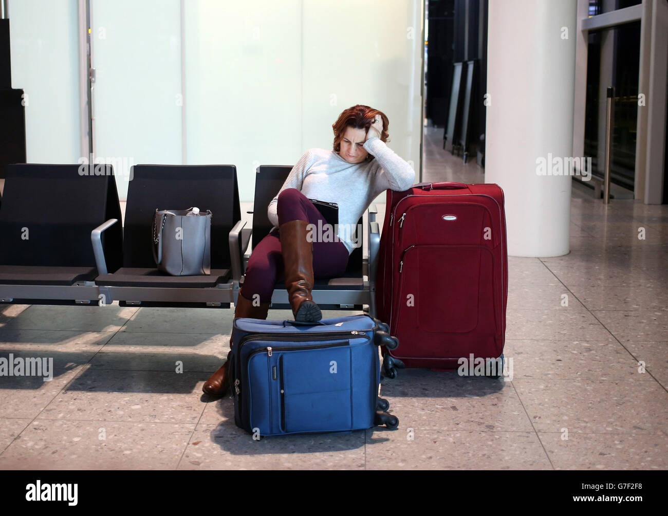 Passenger waits flight in terminal heathrow airport some flights ... Passenger waits flight in terminal heathrow airport some flights ...
