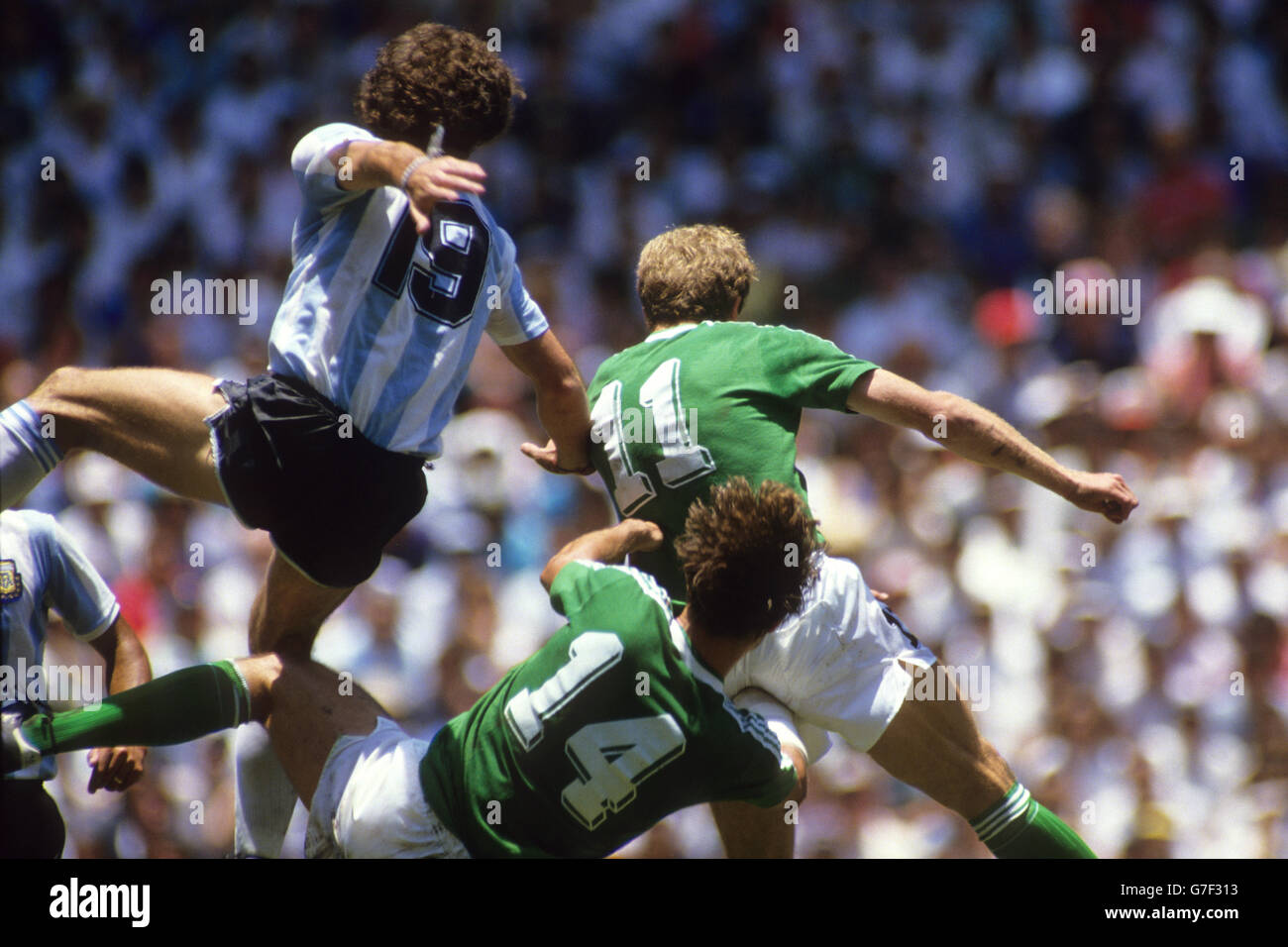 Aerial action shot of Argentina's Oscar Ruggeri tussling with West ...