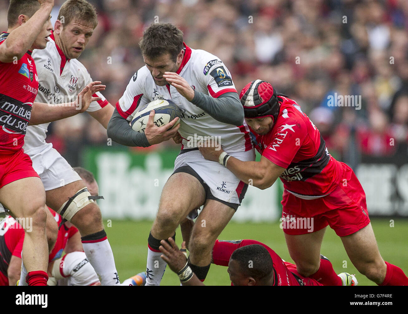 Toulon's Leigh Halfpenny (right) tackles Ulster's Louis Ludik during ...