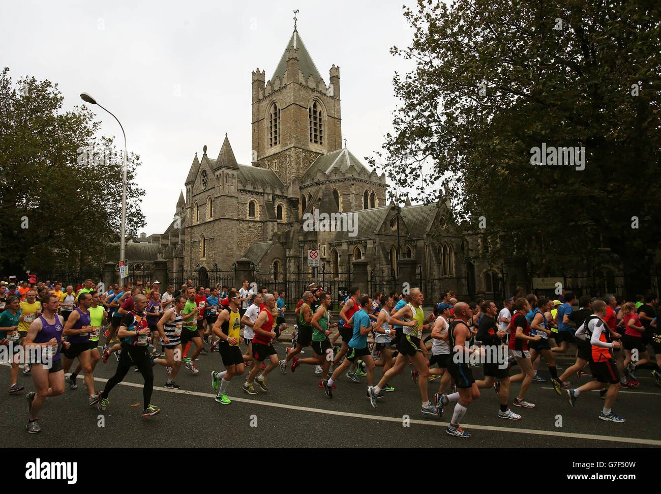 STANDALONE PHOTO. Runners make their way past Christ Church Cathedral ...