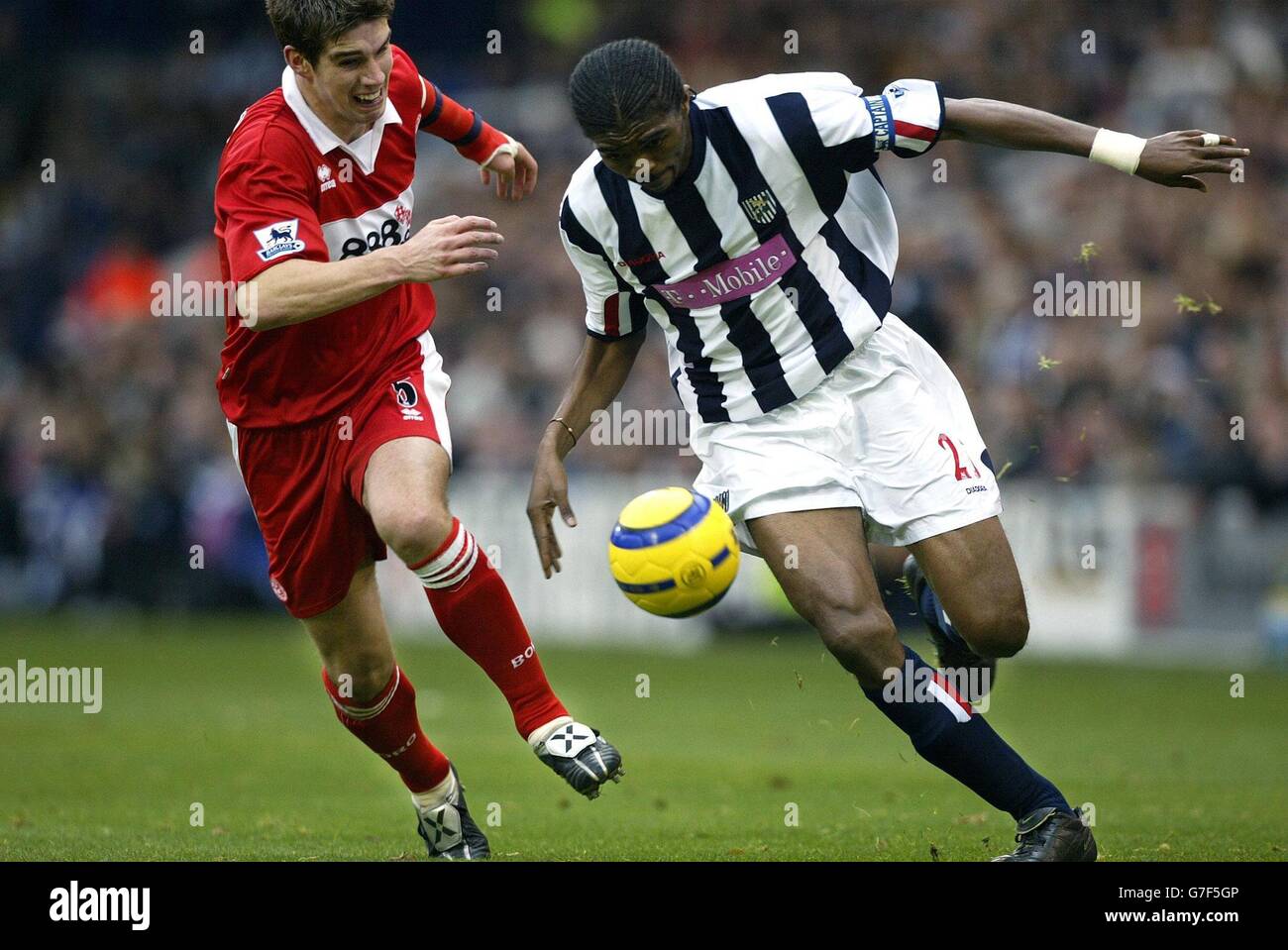 West Bromwich Albion's Kanu (right) holds off Middlesbrough defender ...