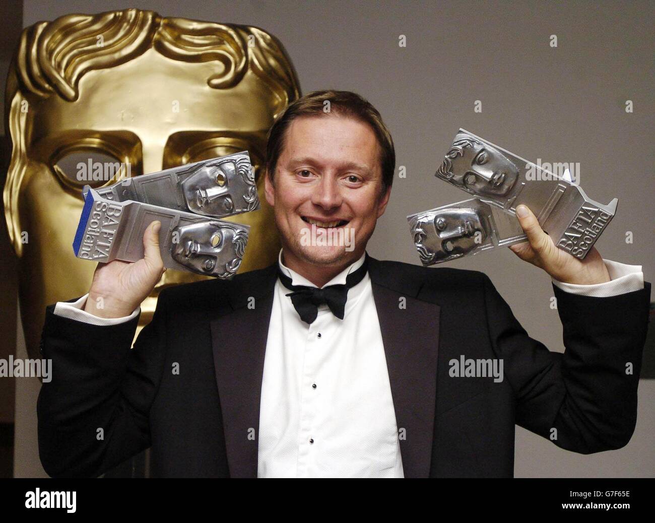 Film Director David MacKenzie holds the four BAFTAS that his film Young ...