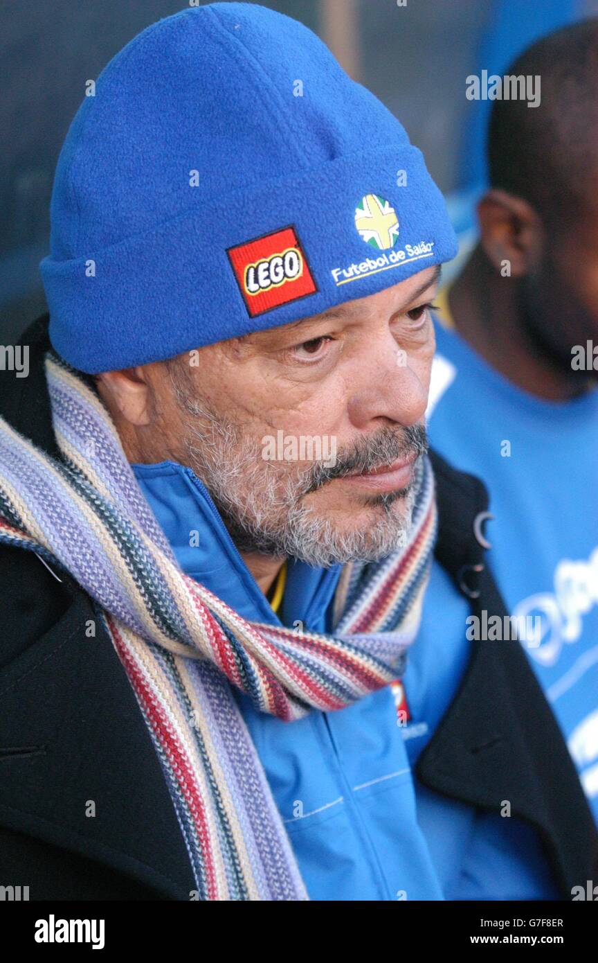 Former Brazilian soccer star Socrates wraps up warm ahead of making his ...