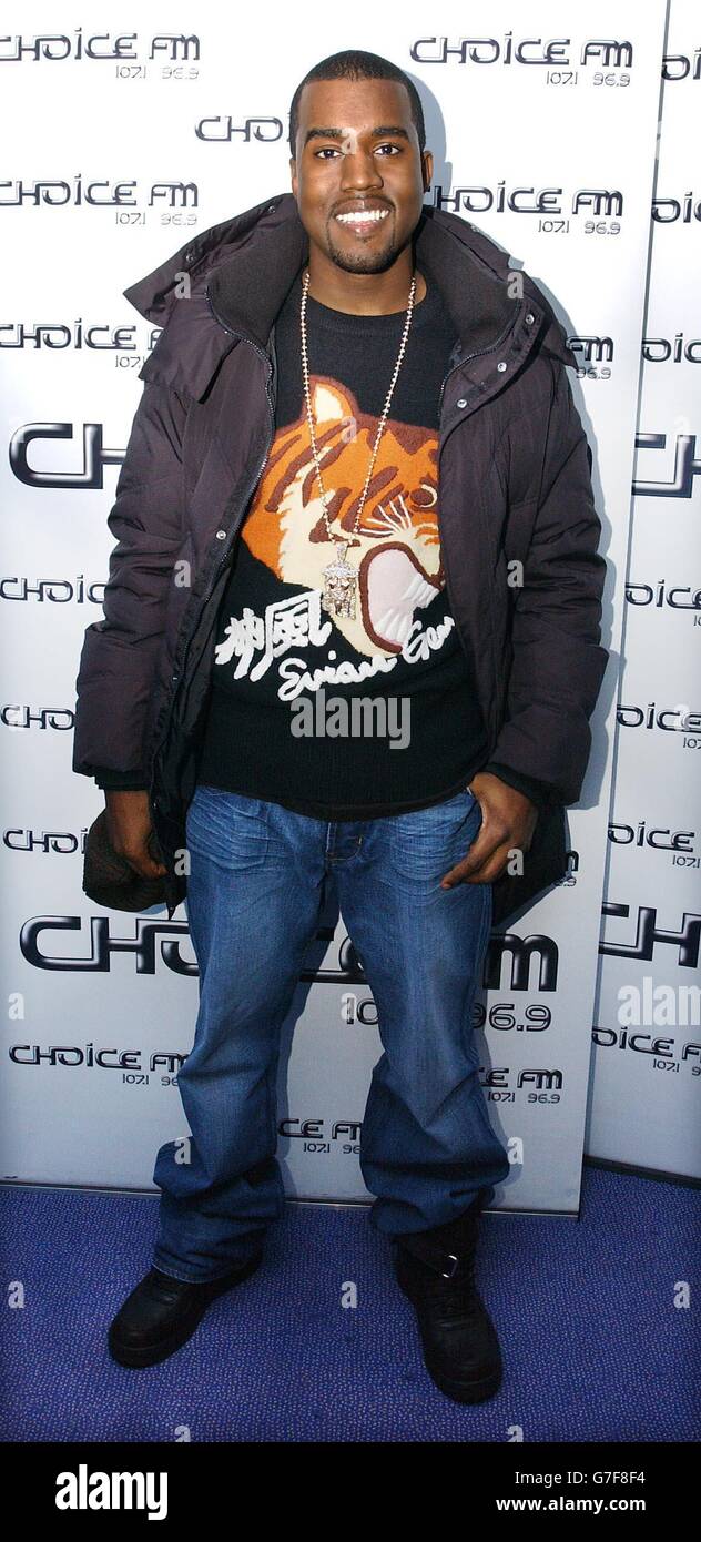 Hip-hop artist Kanye West poses for photographs before his live radio ...