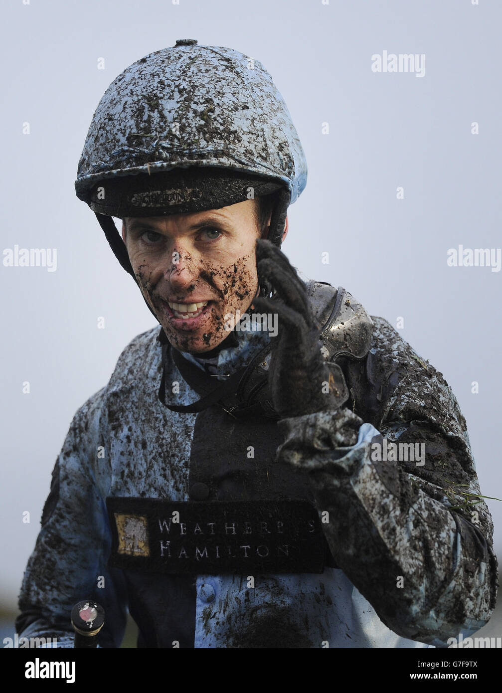 Jockey Graham Lee acknowledges the applause as he returns on Lady Tiana ...