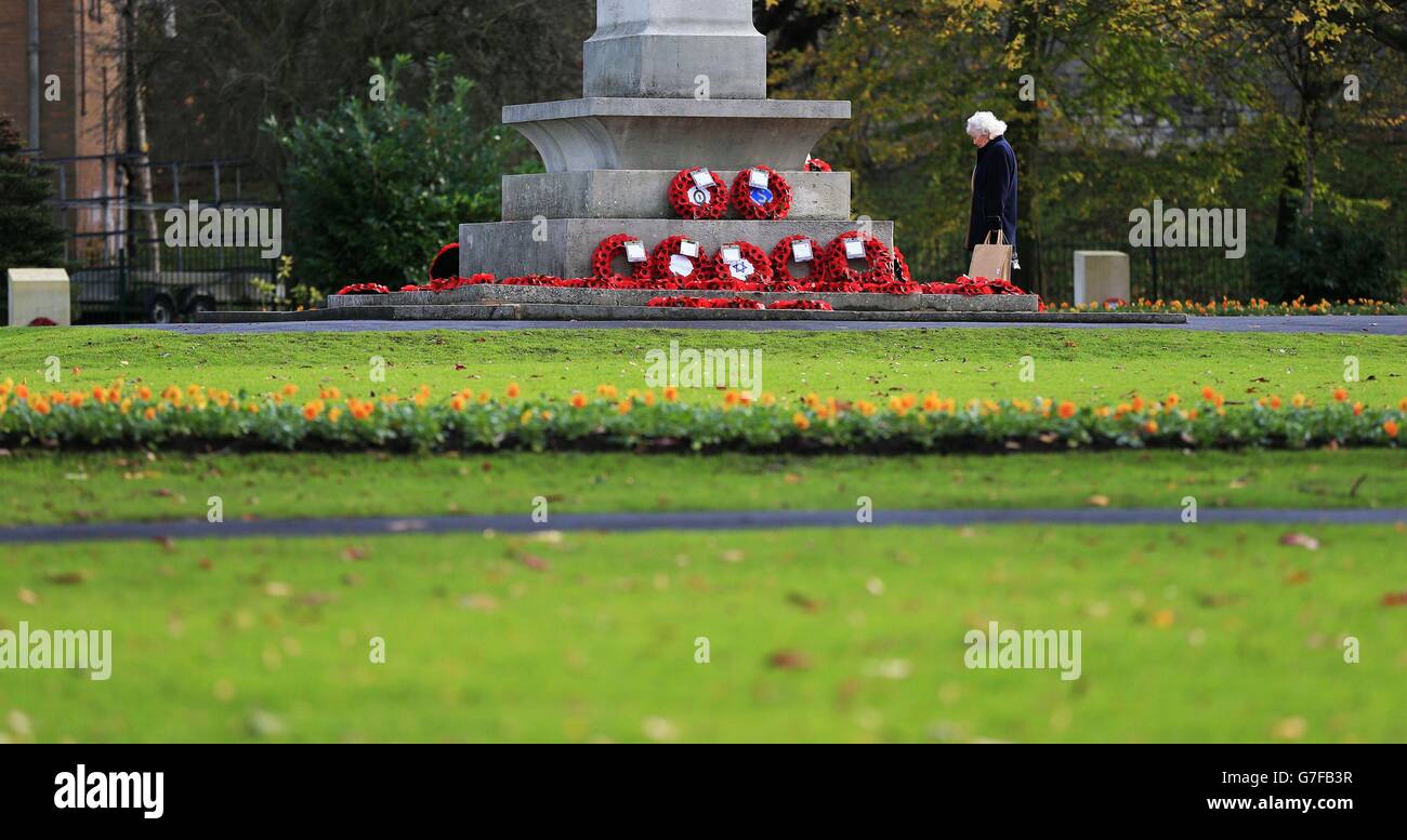 People look at wreaths and poppies in the War Memorial Gardens in York ...
