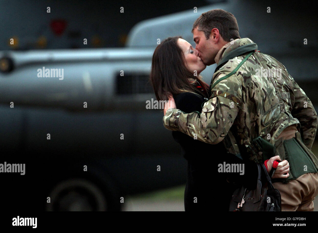 Flight Lieutenant Oliver Payne kisses his partner Liza Brooks, upon ...