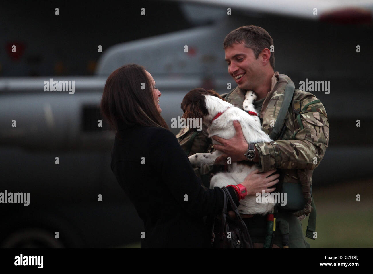 Flight Lieutenant Oliver Payne is greeted by his partner Liza Brooks ...