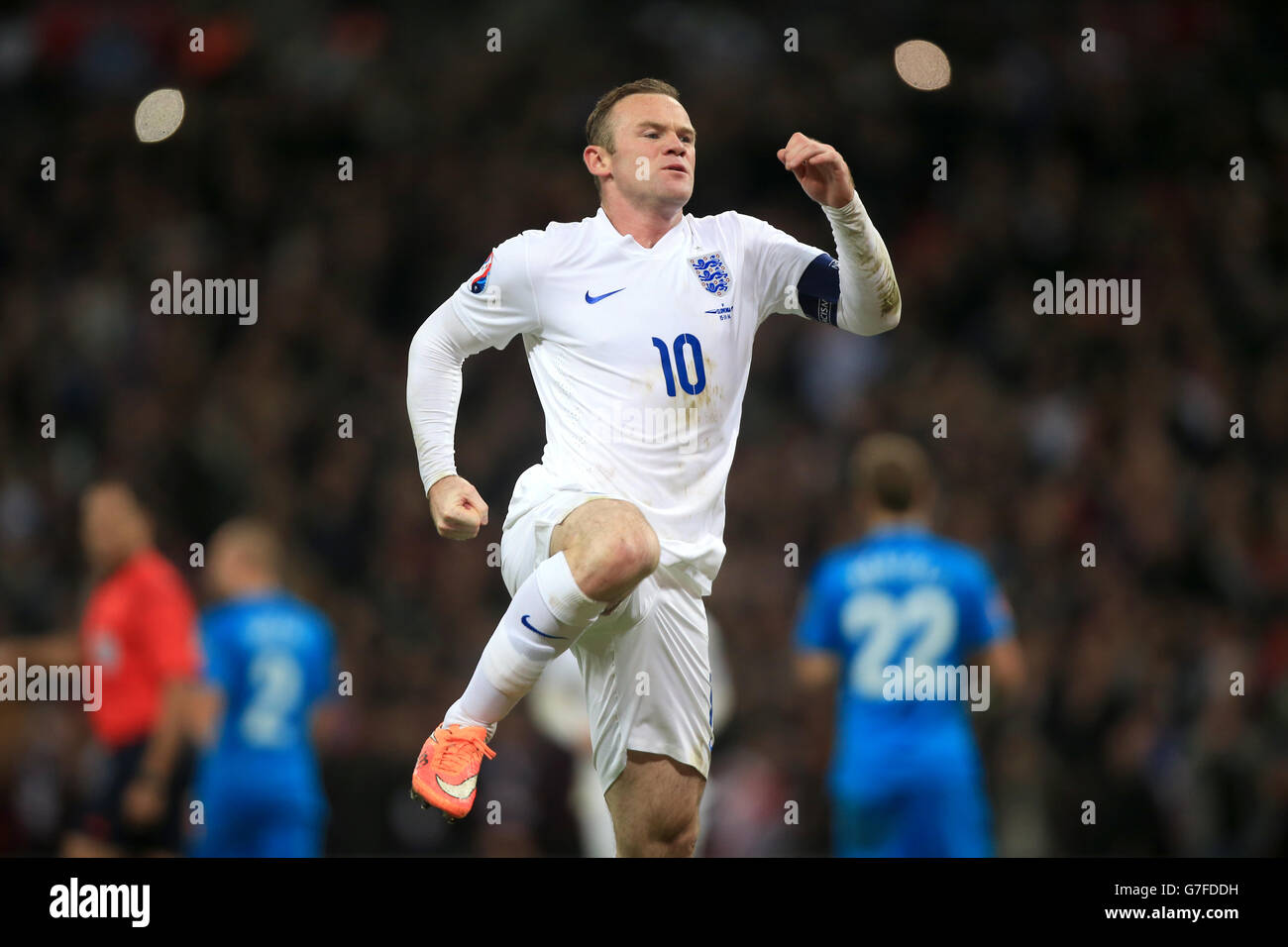 England's Wayne Rooney celebrates scoring his side's first goal of the ...