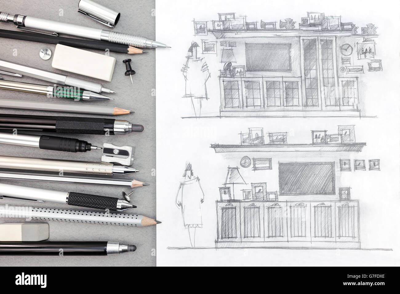 graphical drawings of wall units on designer workplace background with ...