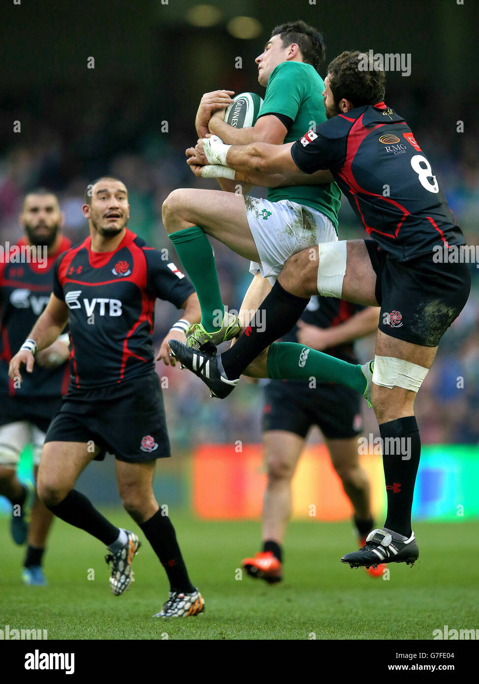 Ireland's Felix Jones (centre) is challenged by Georgia's Merab ...