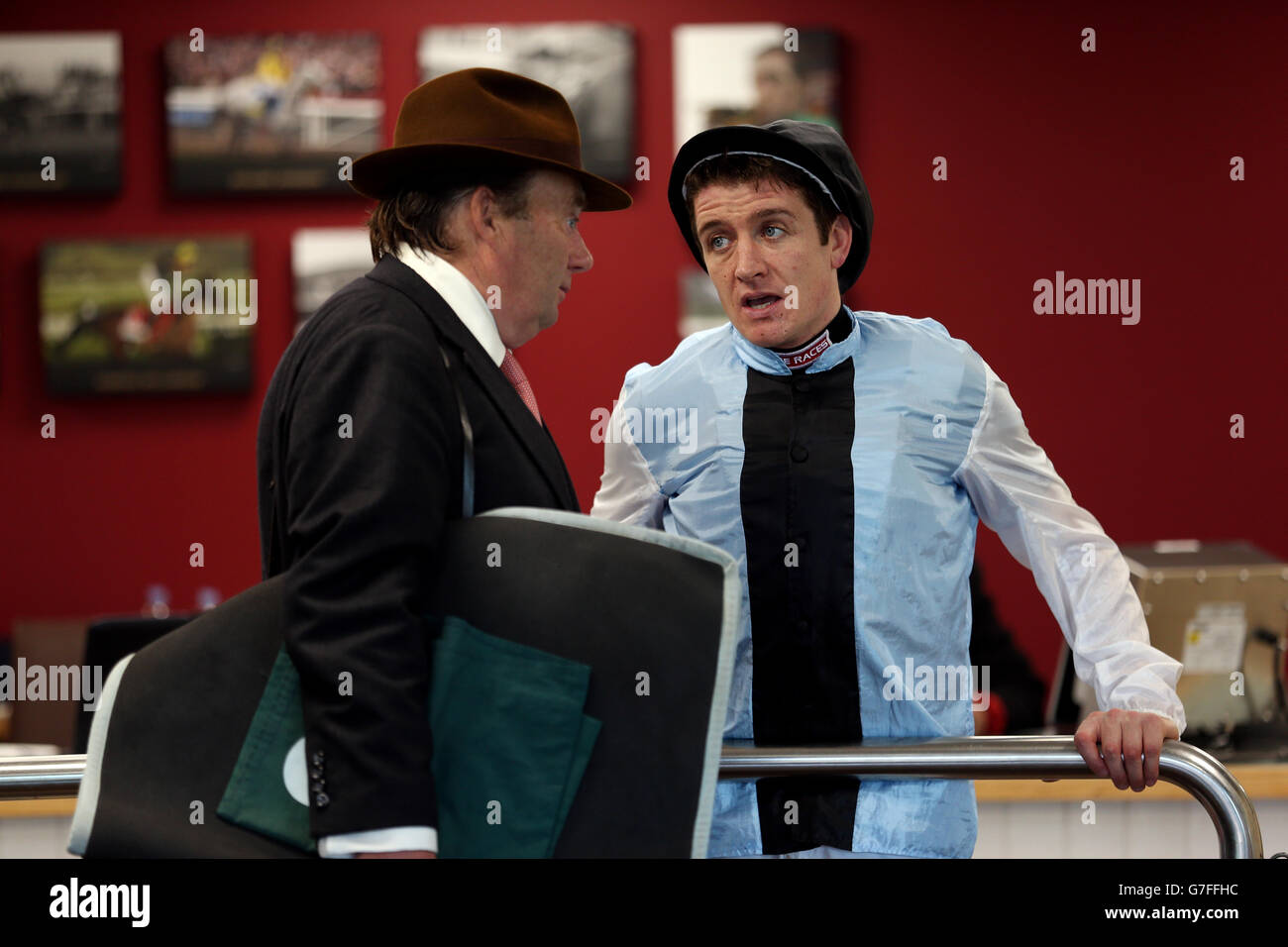 Jockey Barry Geraghty Chats With Trainer Nicky Henderson Before The
