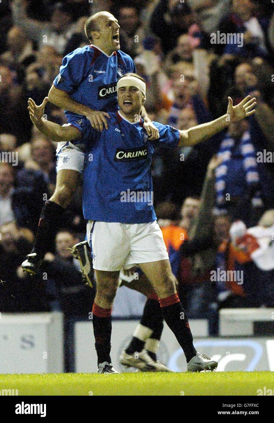 Rangers' Alex Rae climbs on the back of Dado Prso who has scored ...