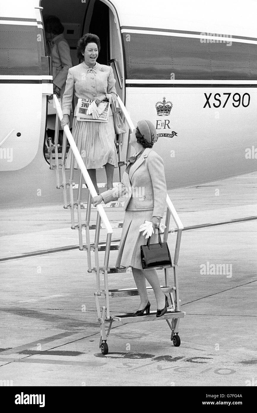 Princess Margaret and Queen Elizabeth II leave an aircraft of the Queen ...