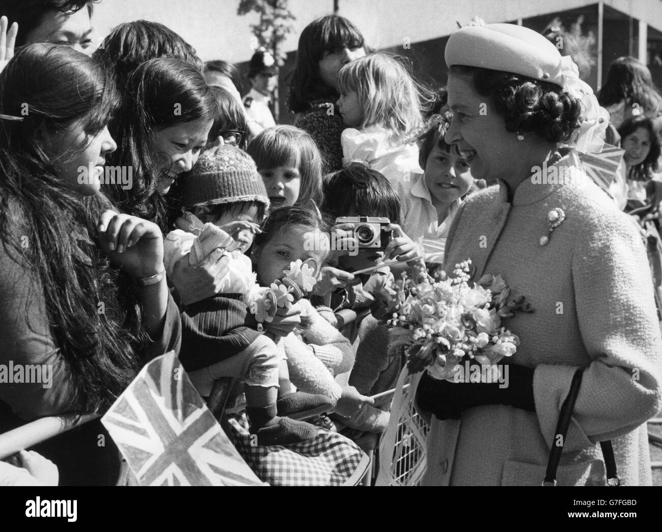 Queen Elizabeth II talks to the crowd during her visit to the Greater ...