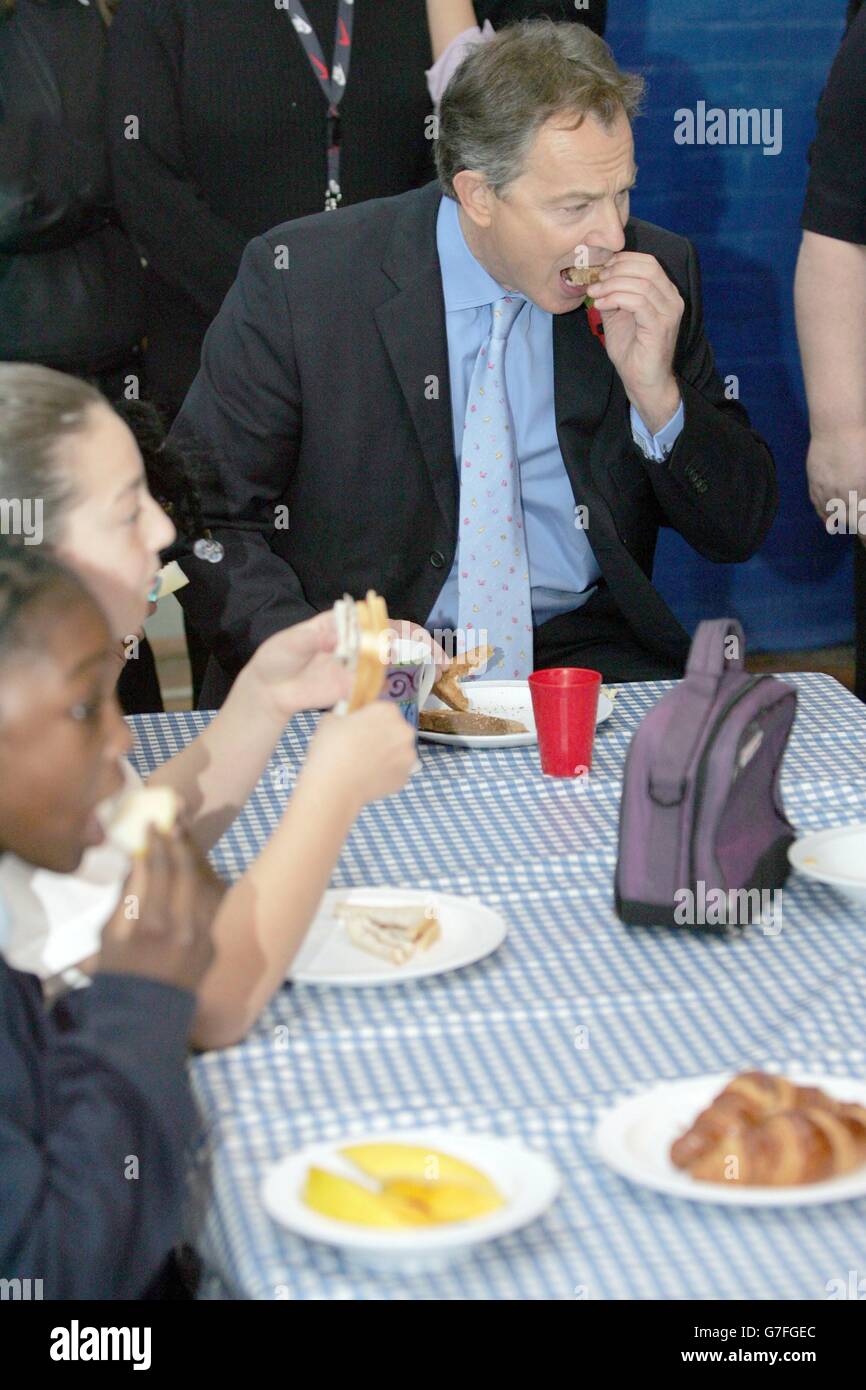 Prime Minister Tony Blair sits with pupils at Millfields School in ...