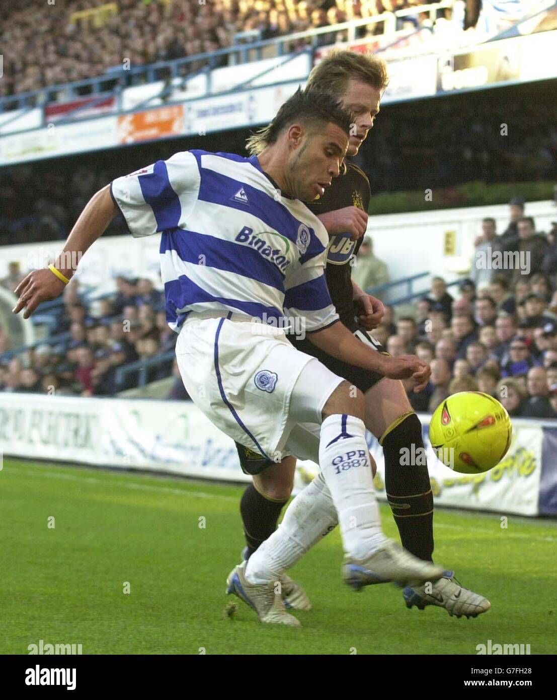 QPR's Marcus Bignot takes on Wigan's Alan Mahon during the Coca-Cola ...