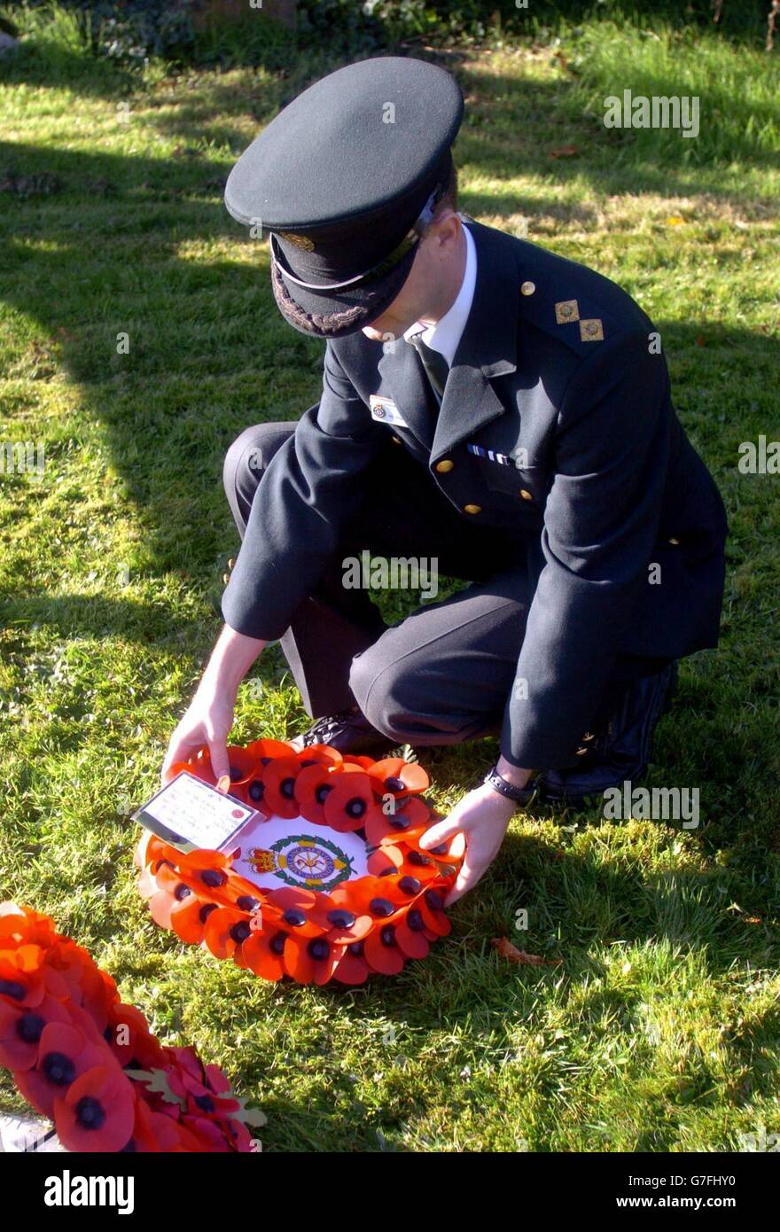 Stephen Hines, from the London Ambulance Service, lays a wreath in ...