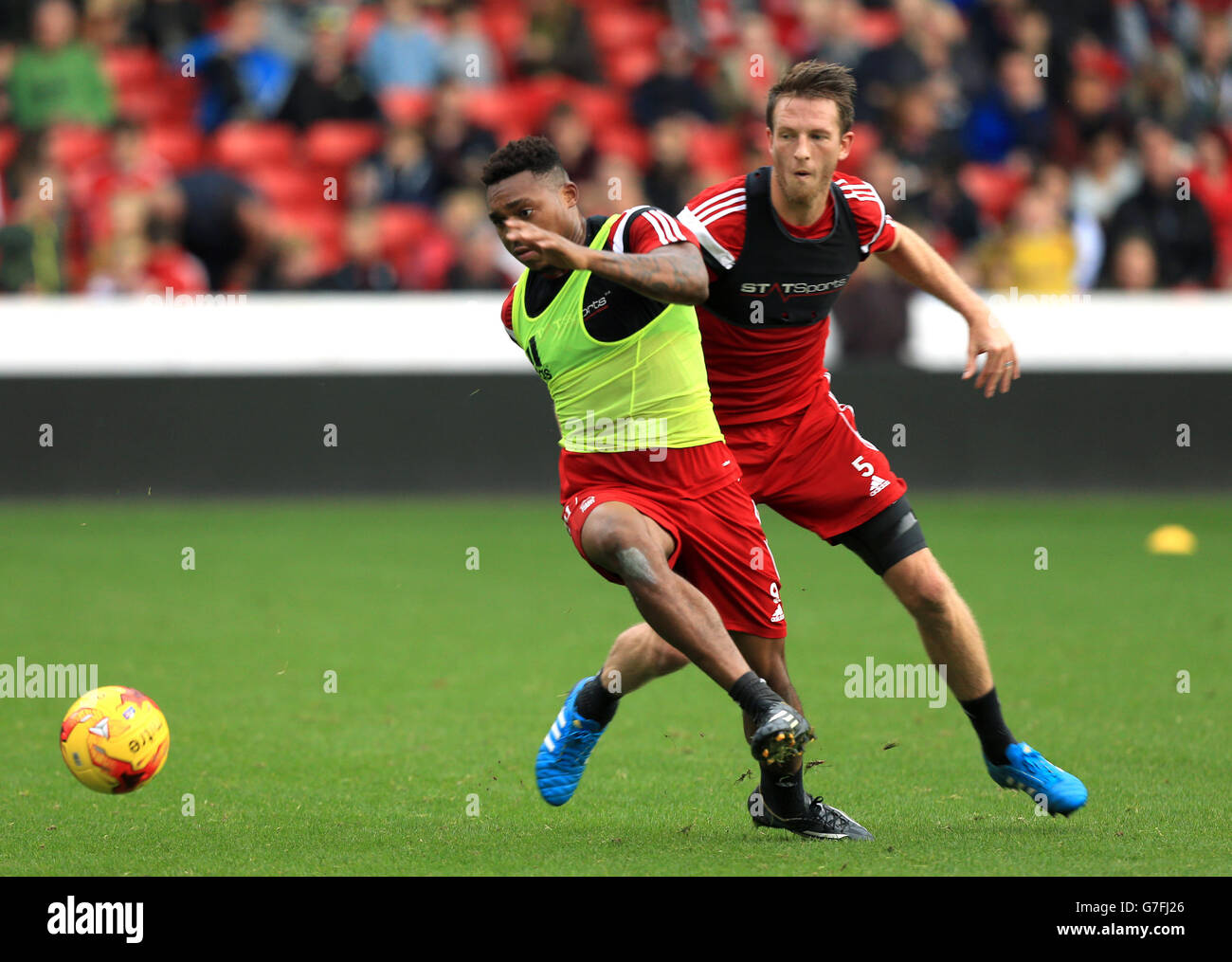 Nottingham Forest's Britt Assombalonga (left) and Danny Collins during ...