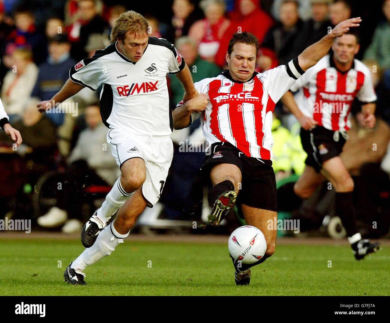 Swansea City's Paul Connor tries to get away from Cheltenham Town ...