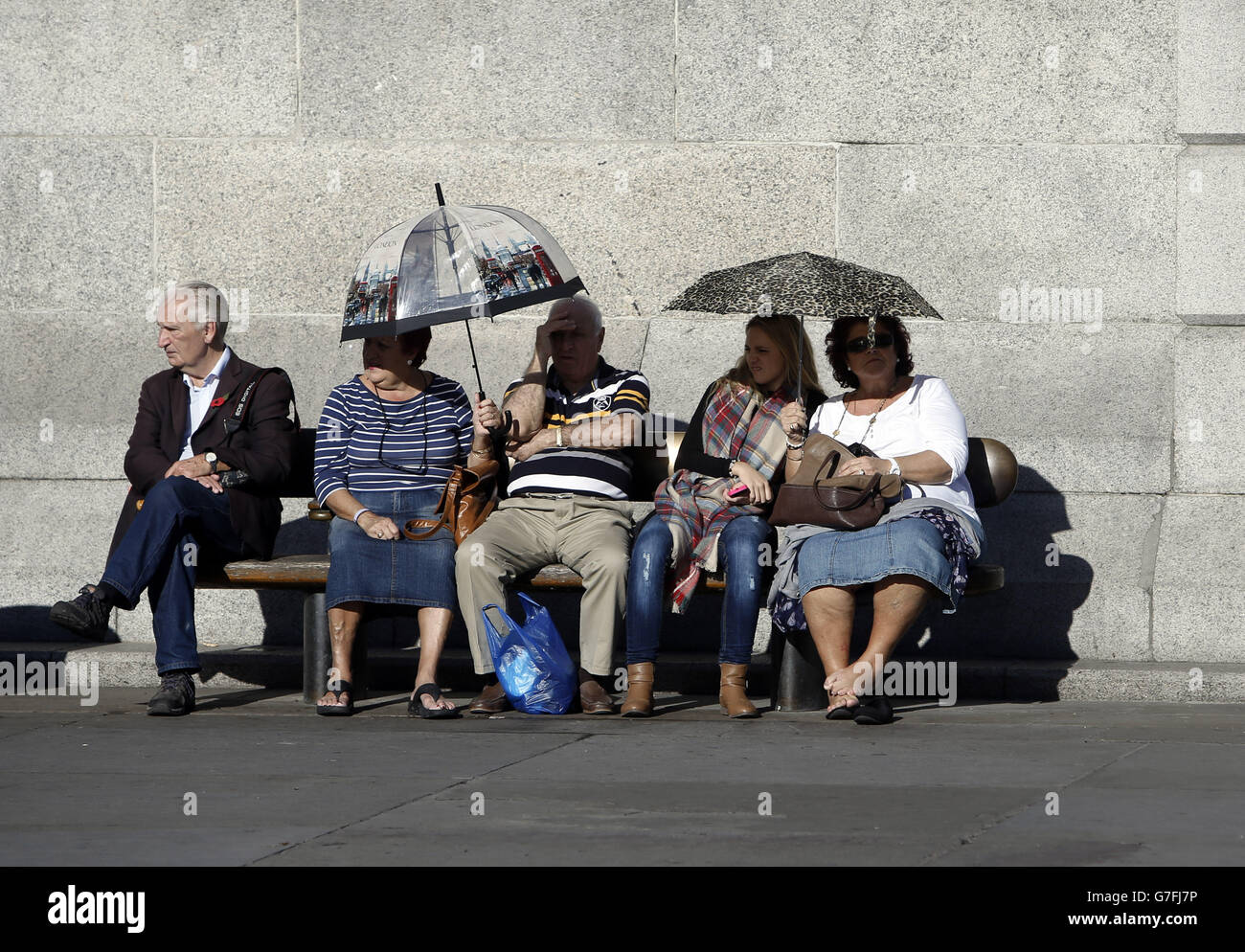 Tourists enjoy the sun in Trafalgar Square, central London, as Britain ...
