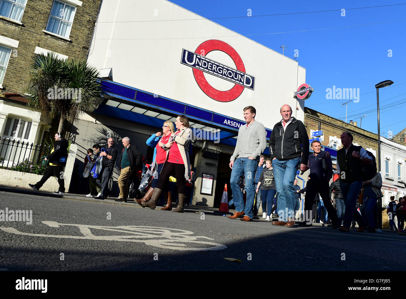 Supporters walk out of Arsenal Underground Station on their way to the ...