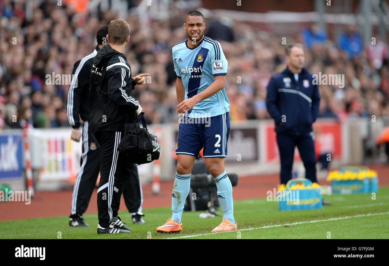 West Ham United's Winston Reid receives treatment after an injury ...