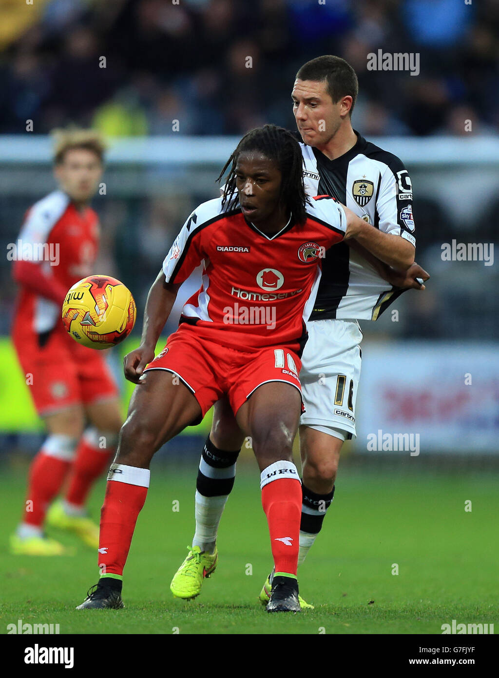 Walsall's Romaine Sawyers (left) and Notts County's Liam Noble battle ...