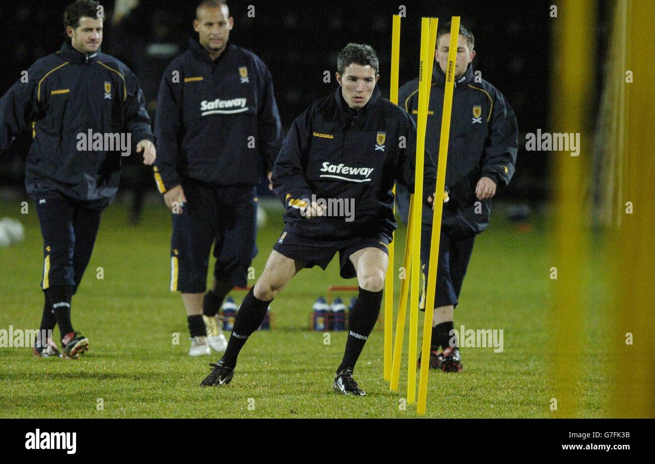 Scotland's Kevin McNaughton (foreground) is put through his paces as ...